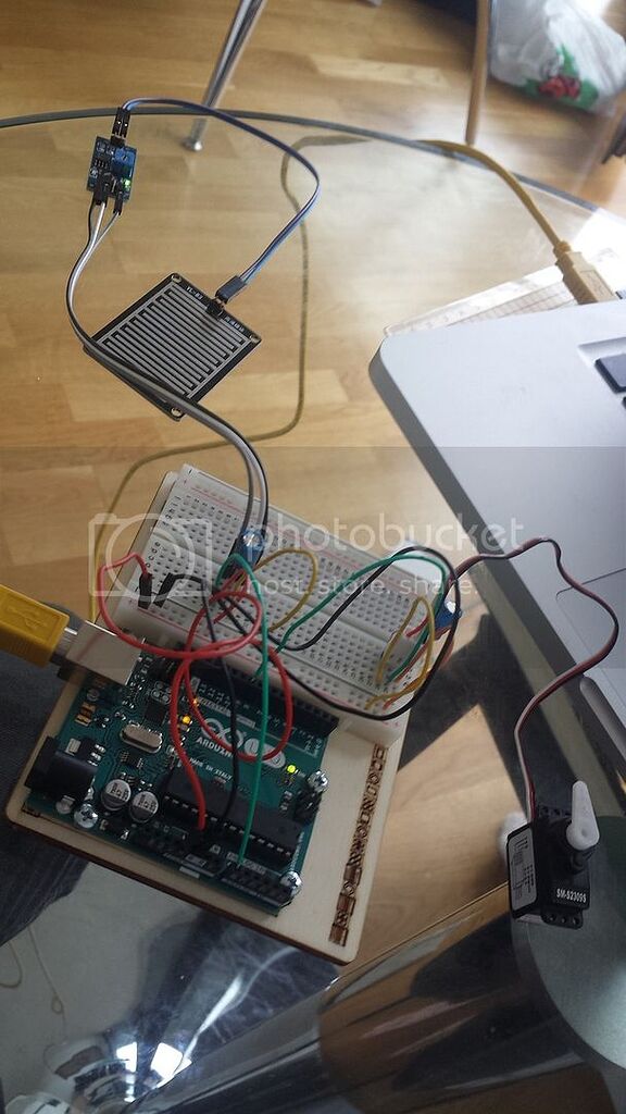 Coding a rain water sensor to a 180 servo - Programming - Arduino Forum